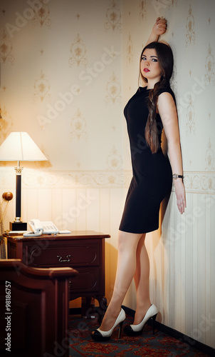 Beautiful Shapely Brunette Girl With Long Braid Wearing A Dress Gown