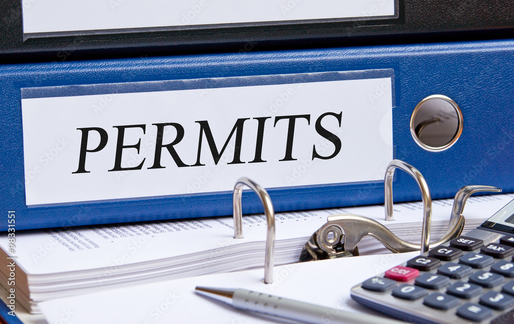 Permits binder blue color with calculator and pen in the office Stock ...