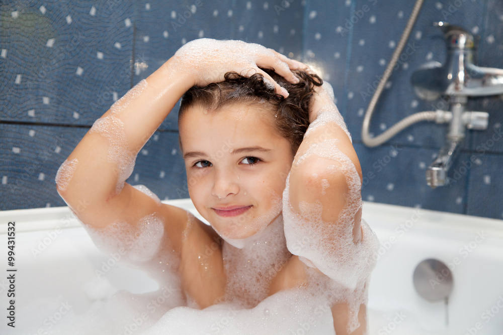 little girl washes her head in the bath Stock Photo | Adobe Stock