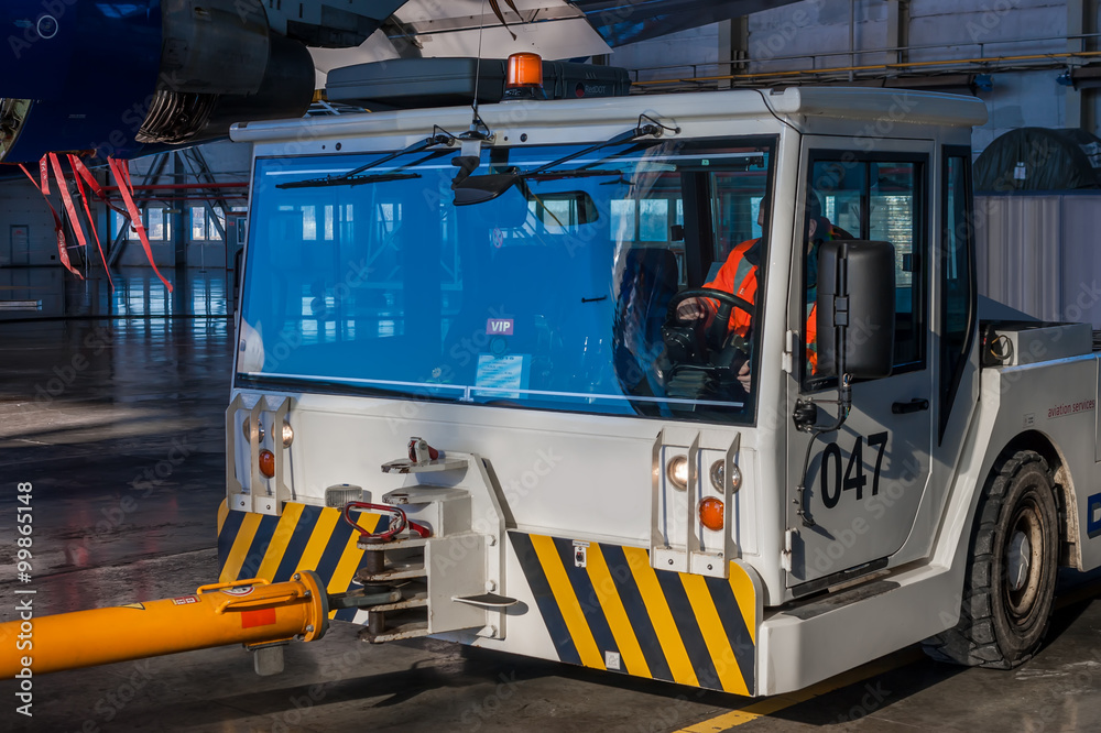 TUG Pushback tractor in hangar. Stock Photo | Adobe Stock
