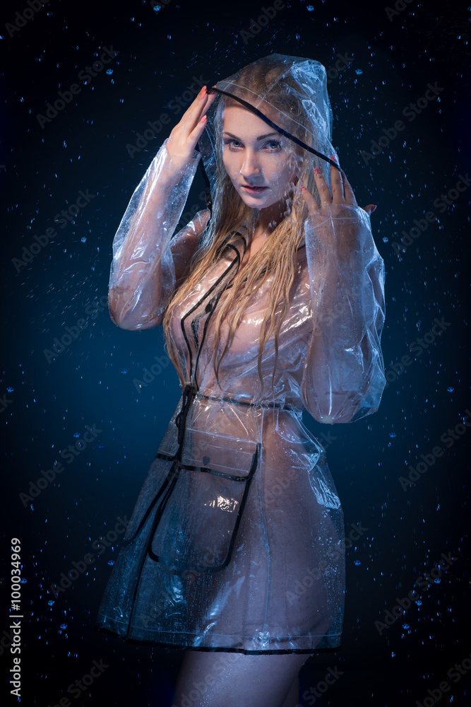Attractive Blonde naked woman in raincoat posing during rain の Stock フォト | Adobe Stock