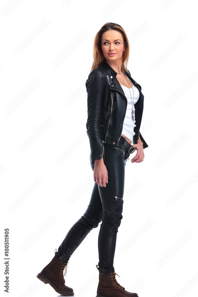 girl in leather jacket pose walking in studio background while l Stock ...
