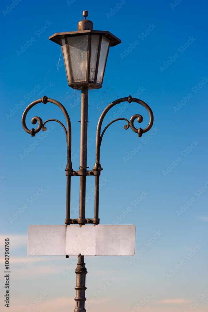 Vintage Lamp Post with Empty Signboard / Old vintage lamp post with ...