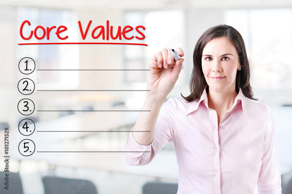 Business woman writing blank Core Values list. Office background. Stock ...