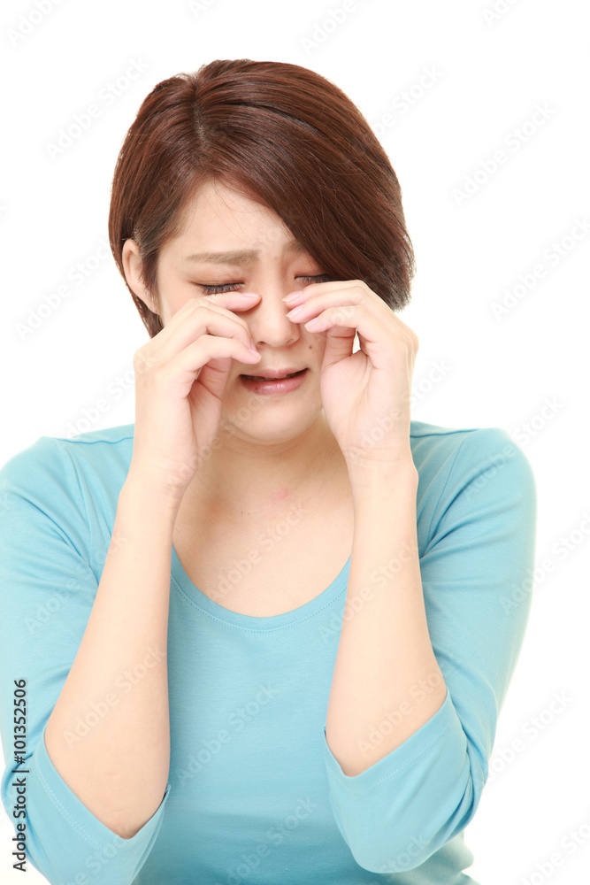 crying young Japanese woman Stock Photo | Adobe Stock