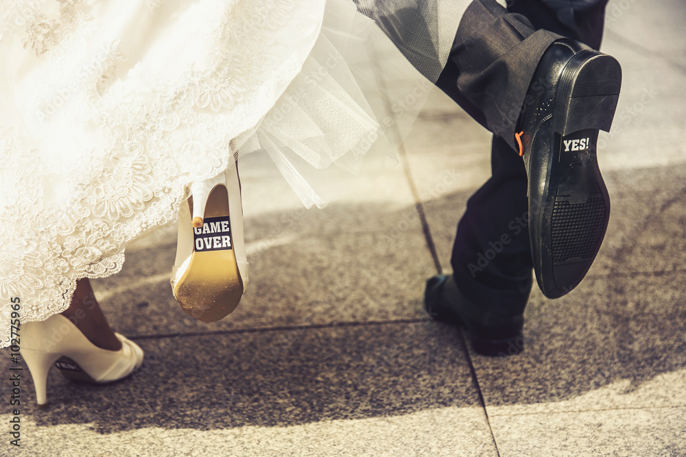 Młoda Para pokazuje napis na butach "Game Over" Stock Photo | Adobe Stock