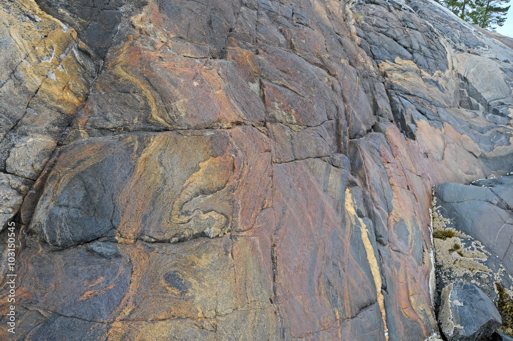 Granite rocks atop million year old igneous volcanic rock at sunset ...