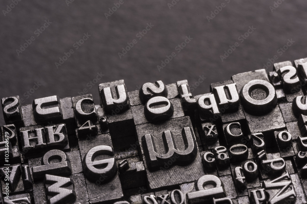 Metal Letterpress Types. A background from many historic typographical ...