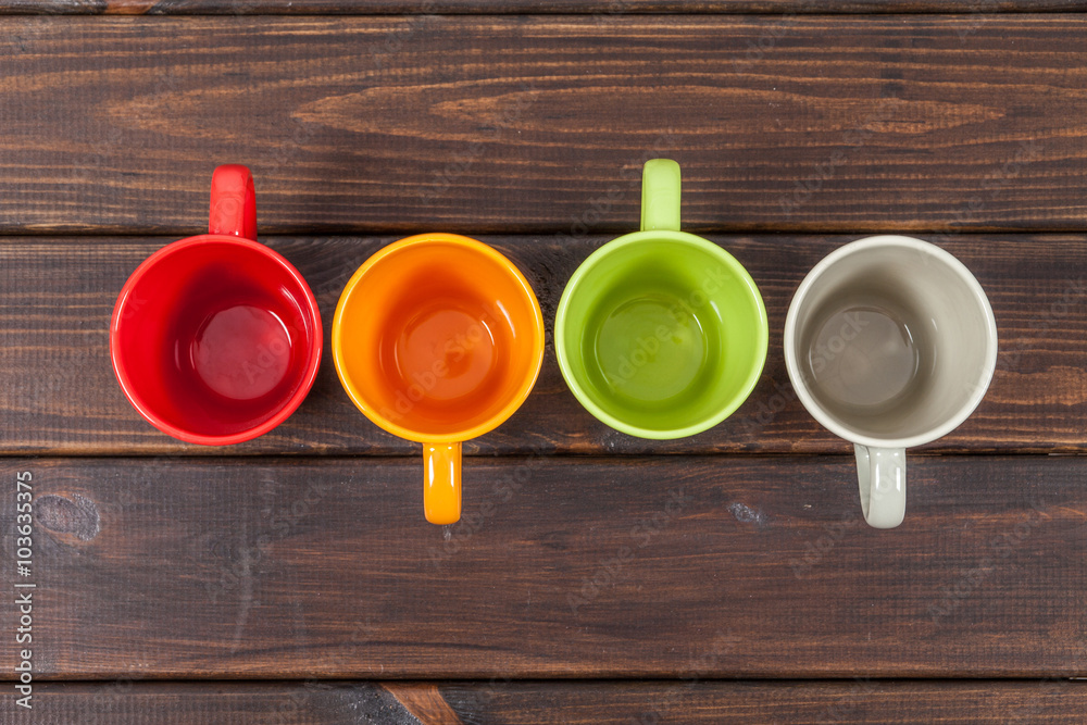 Four color empty tea cups arranged in one row - top view Stock Photo ...