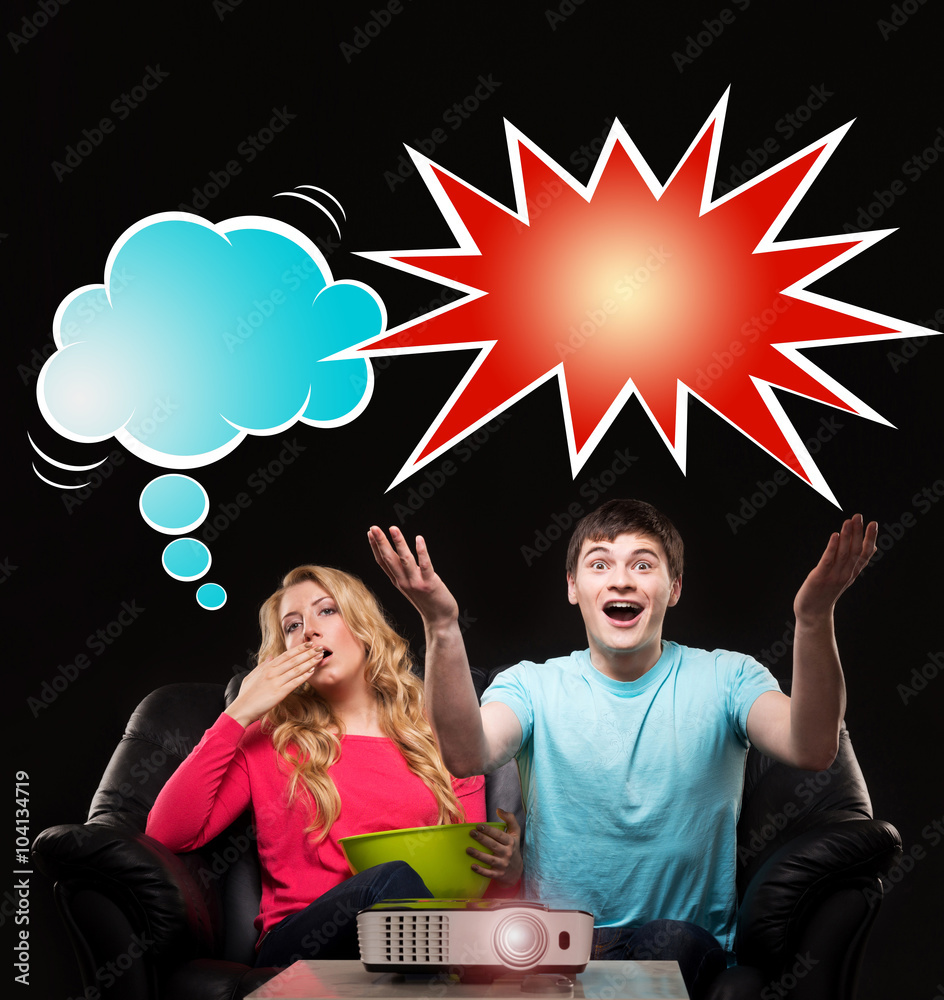 Young family watching a movie or a sport broadcast on a laser pr Stock ...