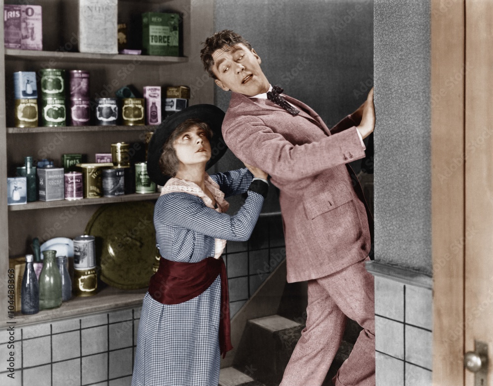 Profile of a young woman pushing out a young man from a domestic ...