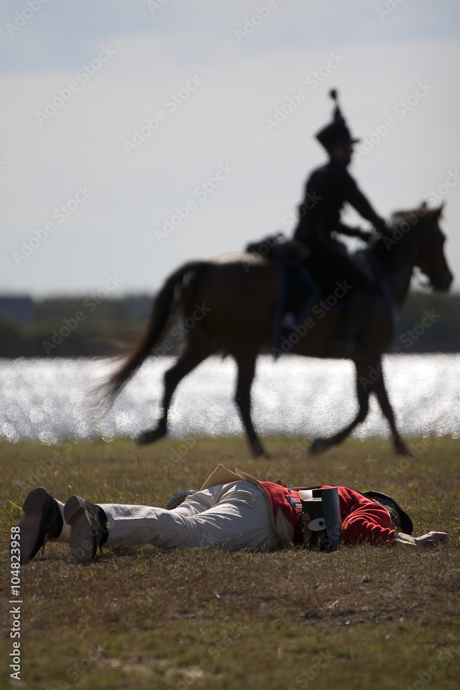 Napoleonic era soldier lies dead in a battle re-enactment whilst ...