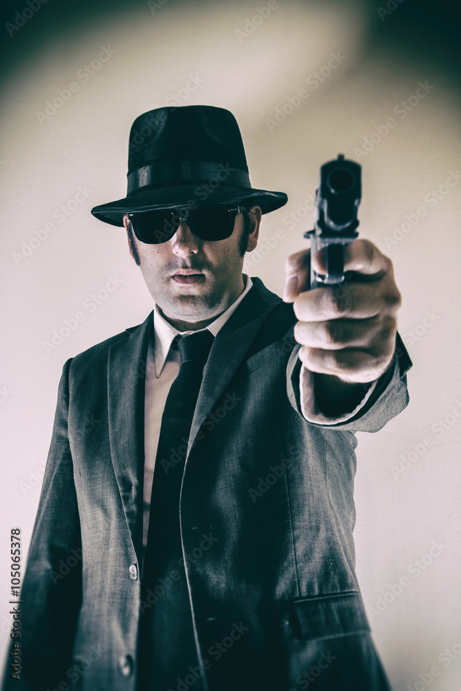 Noir Man Pointing Gun Right Hand. Man in suit, hat and sunglasses ...