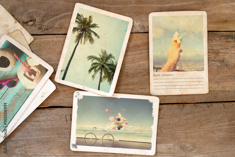 Summer photo album on wood table. instant photo of polaroid camera ...