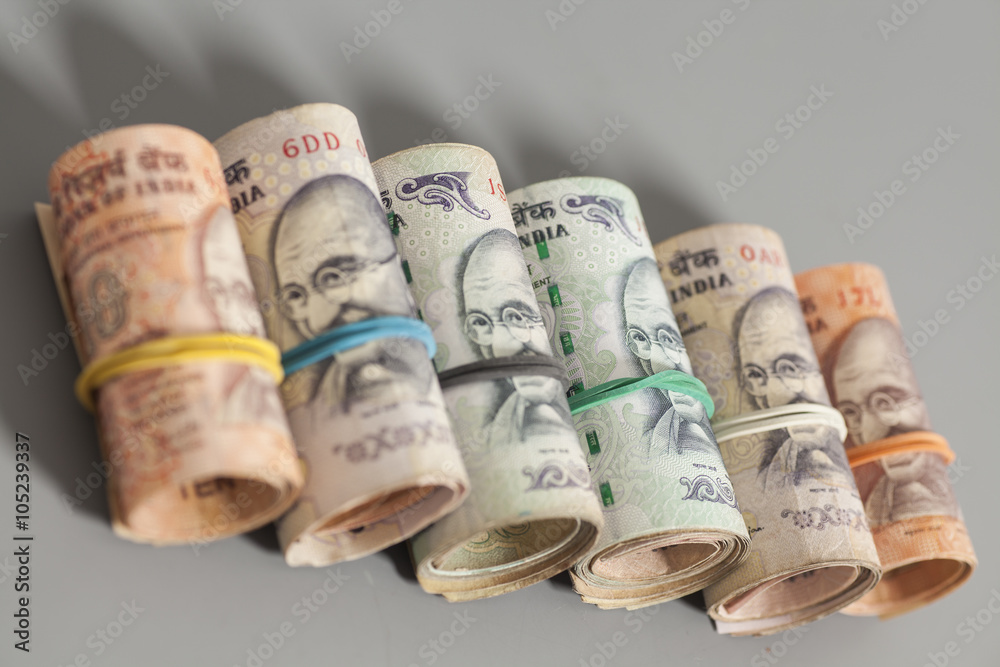 Roll of Indian rupee banknotes Stock Photo | Adobe Stock