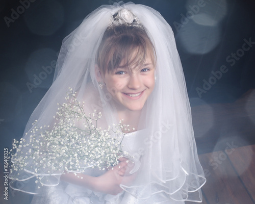 Very young bride. Wedding white dress. Luxury veil. Happy smile ...