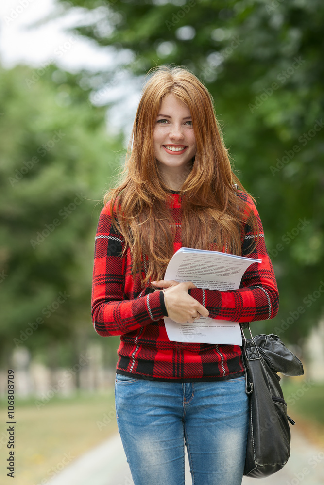 Young laughing adorable redhead student woman in red plaid jacket ...
