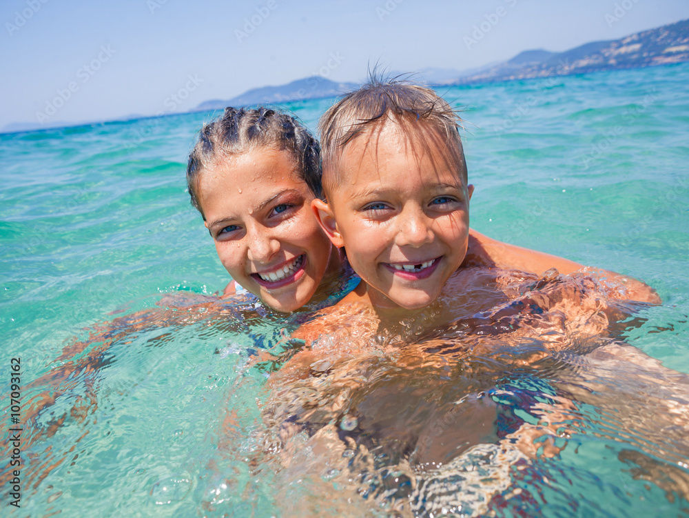 Kids playing in sea. Stock Photo | Adobe Stock