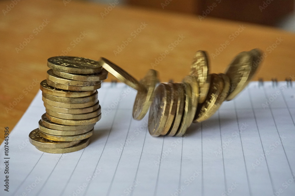 Money background of falling pile of coins made of gold and gilt metal ...