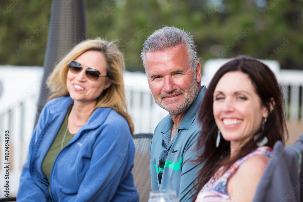 Foto de Stock Group of attractive middle-aged friends outside | Adobe Stock