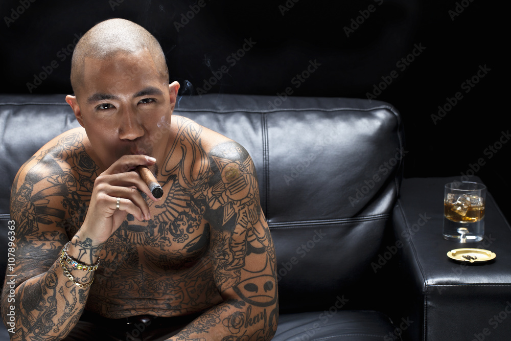bald african american gangsta smoking cigar. Stock Photo | Adobe Stock