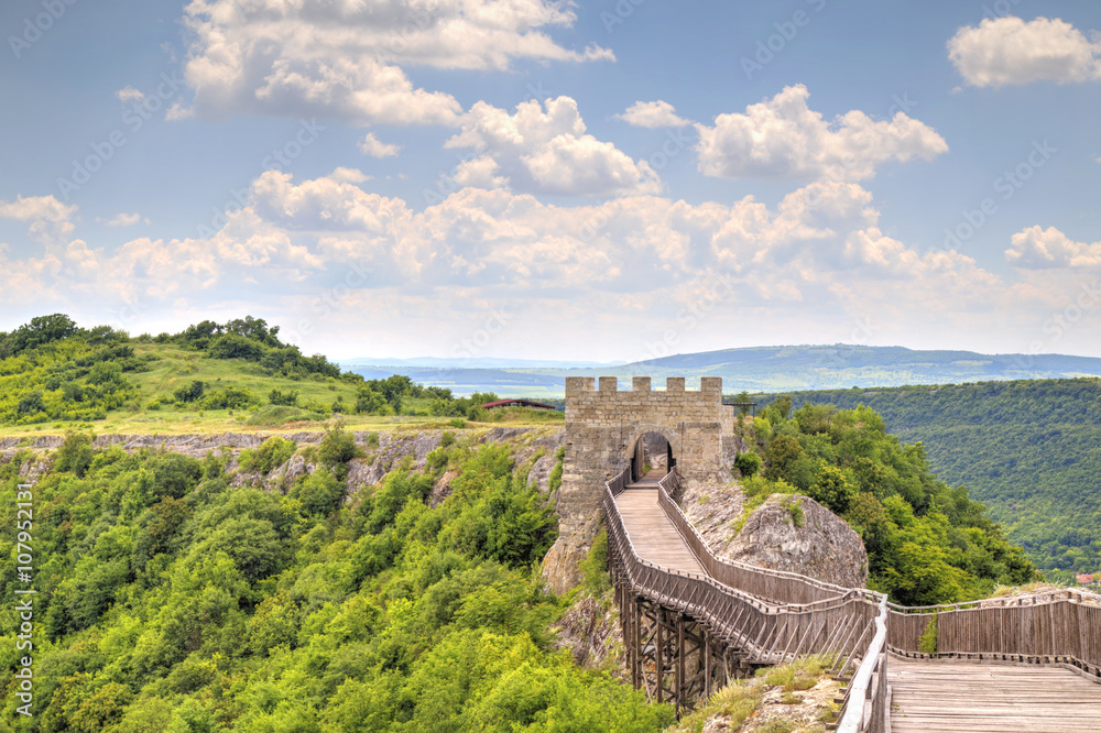 Stone walls and gate with wooden bridge of medieval fortress Stock ...