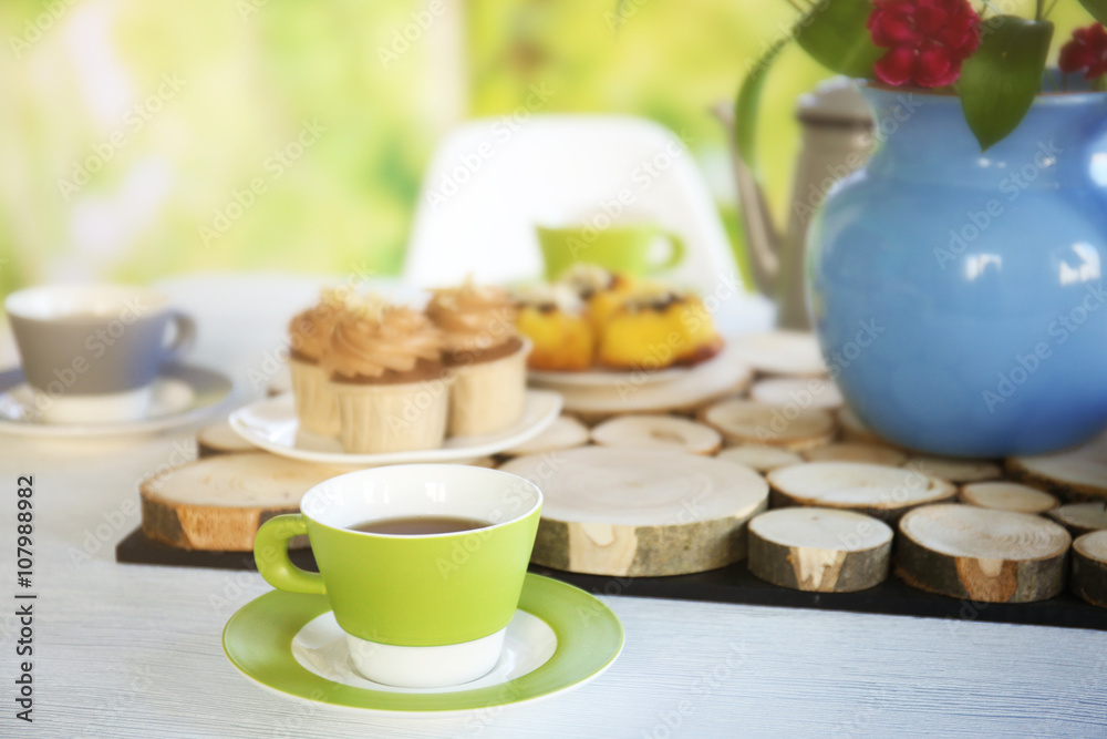 Table setting with tea and cakes indoors Stock Photo | Adobe Stock