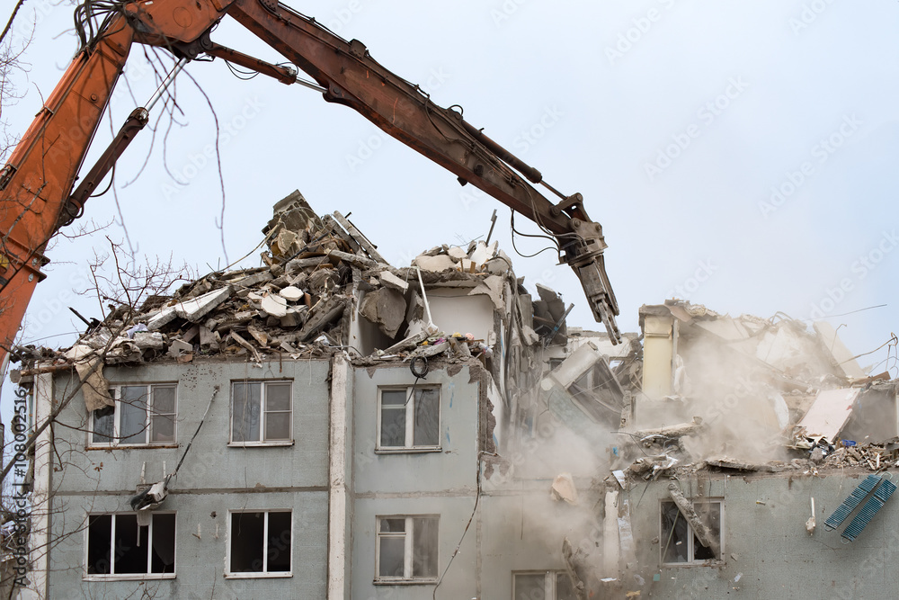 Demolition of a residential house using building hydraulic shears Stock ...