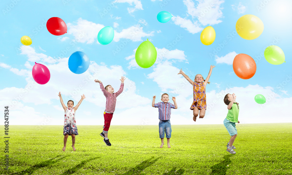 Foto de Stock Playful children catch balloons | Adobe Stock