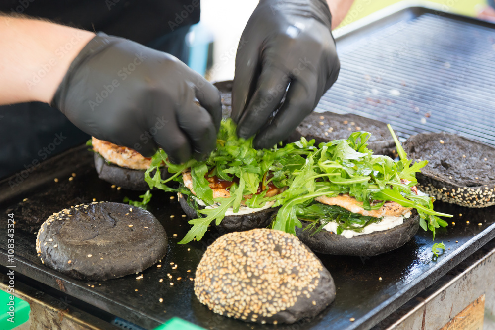 Chef making beef burgers outdoor on open kitchen international food ...