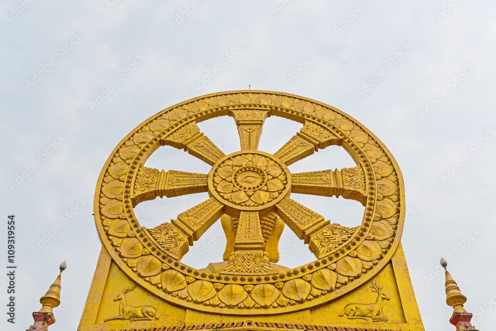 Golden Wheel of Dhamma on sky clouds (Dharmachakra ) Thai Art in public ...
