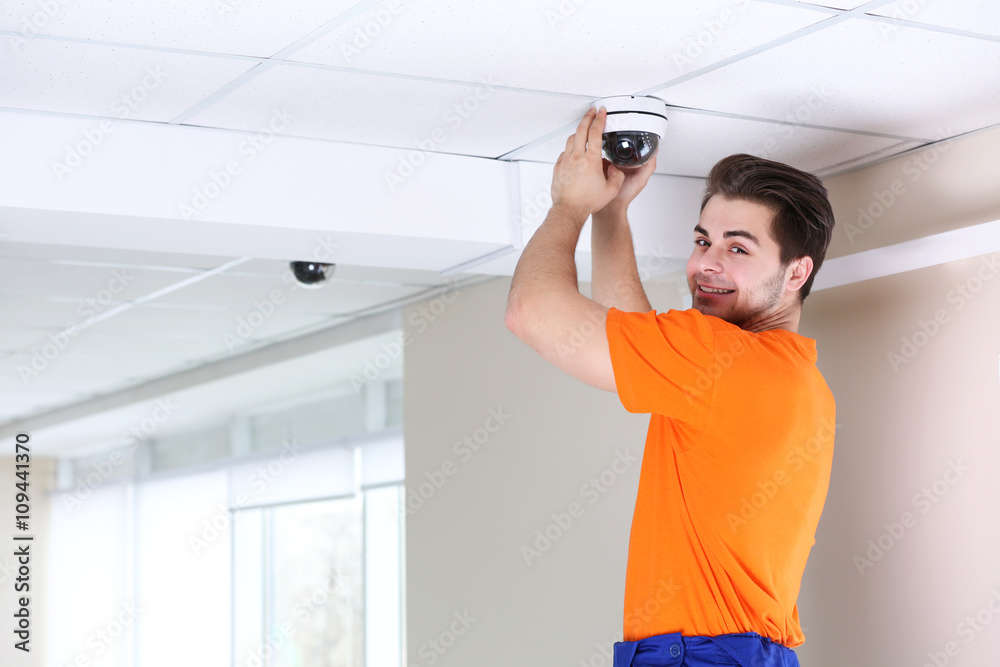 Professional CCTV technician working. Stock Photo | Adobe Stock