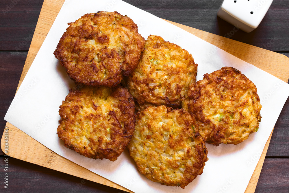 Rice patties or fritters made of cooked rice, carrot, onion, garlic and ...