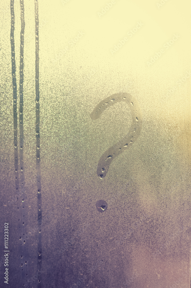 Inscription concept of question mark drawing on fogged window glass ...