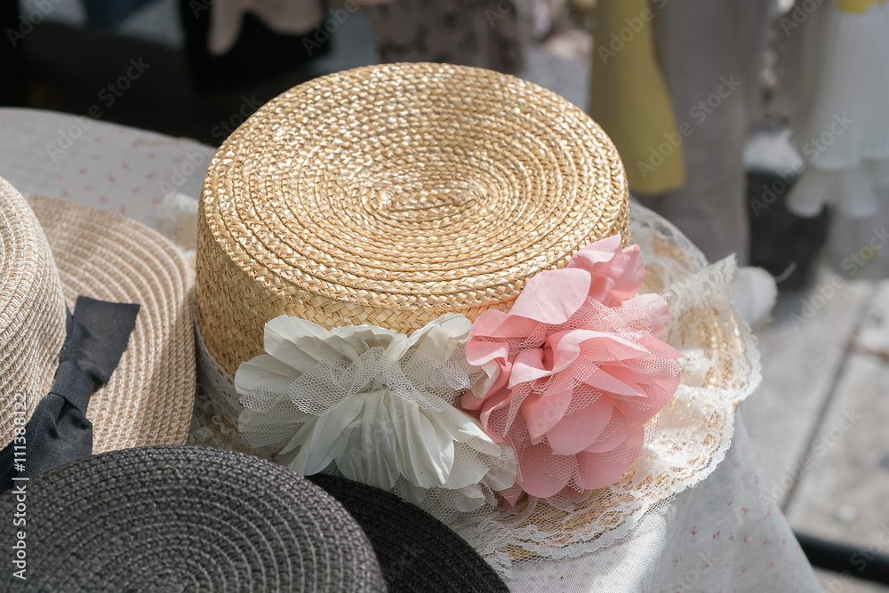 Pretty straw hat with flower Stock Photo | Adobe Stock