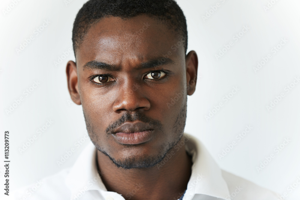 Highly-detailed close up shot of young African man with moustache and ...