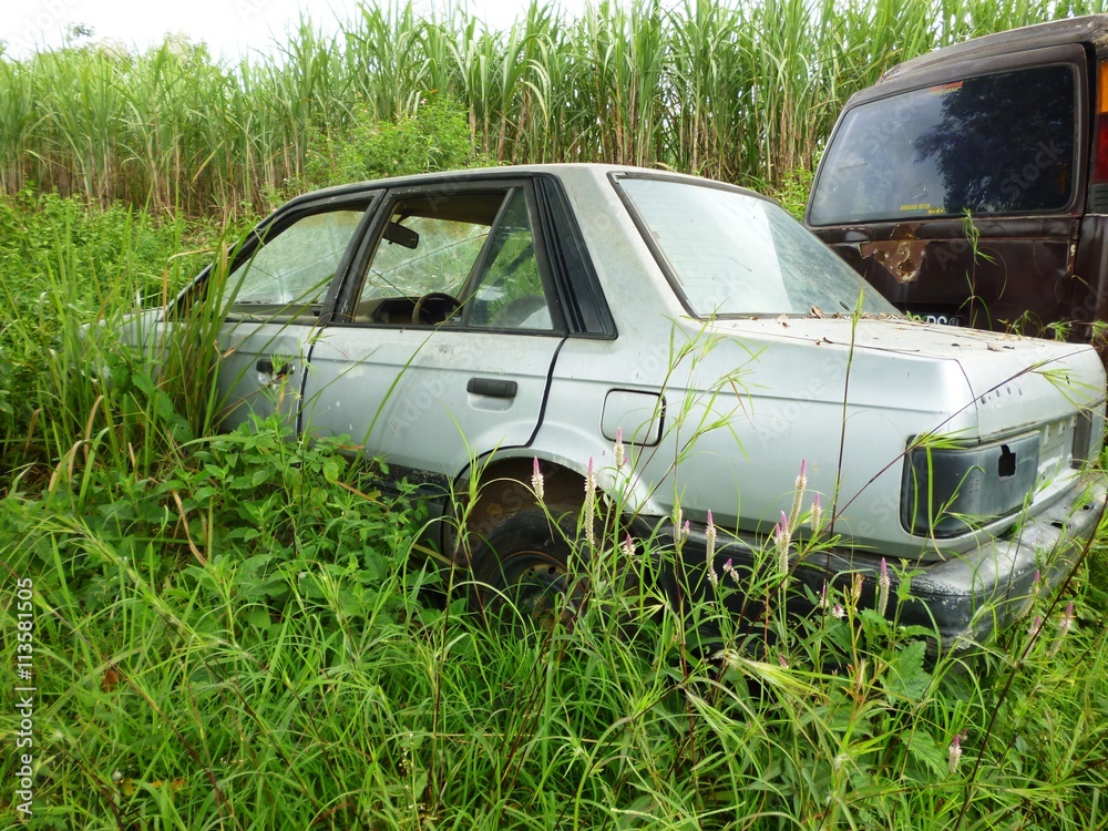 An old unused abandoned vehicle aka dumped car Stock Photo | Adobe Stock