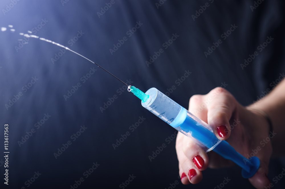 Medical injection on dark background. Medicine plastic vaccination ...