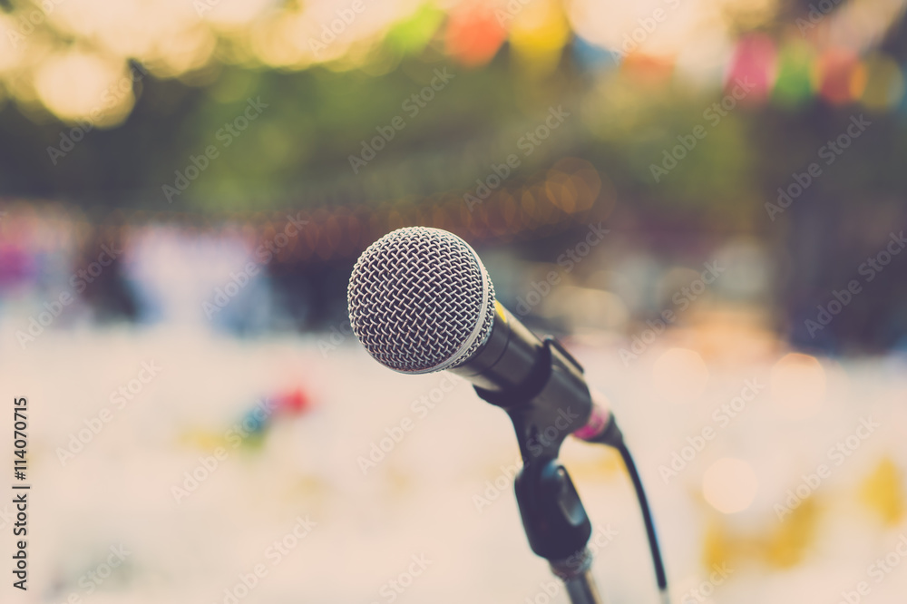 Microphone on outdoor stage. Vintage filter Stock Photo | Adobe Stock