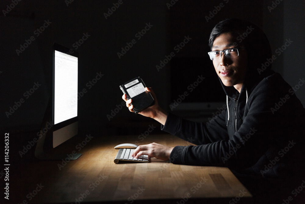 Hacker using computer and stealing information from hard disk Stock ...