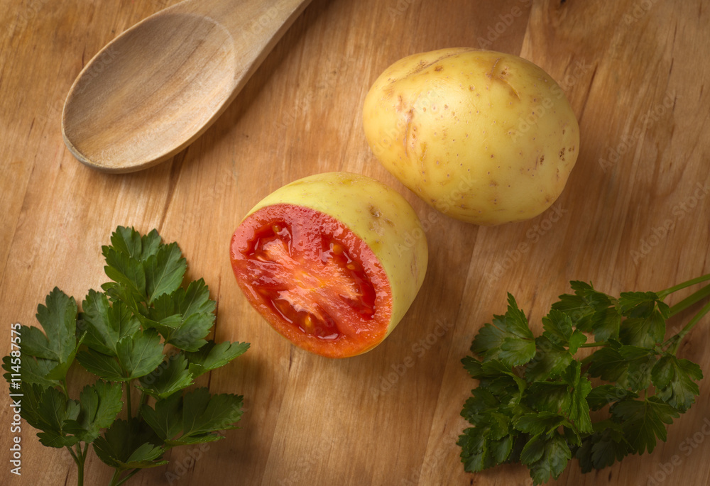 GMO Awarness conept genetic modified potato mutation wooden back Stock ...