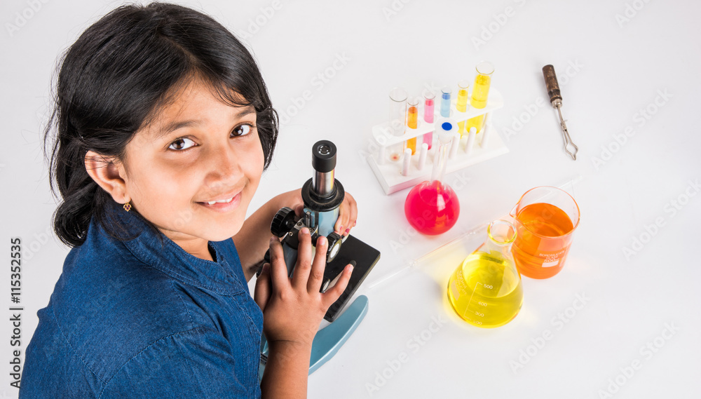 Photo Stock curious indian girl with microscope, asian girl with ...