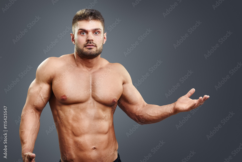 Muscular shirtless young man confused and shrug Stock Photo | Adobe Stock