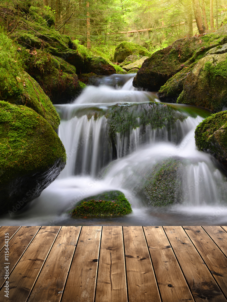 Beautiful waterfall with wooden planks Stock Photo | Adobe Stock