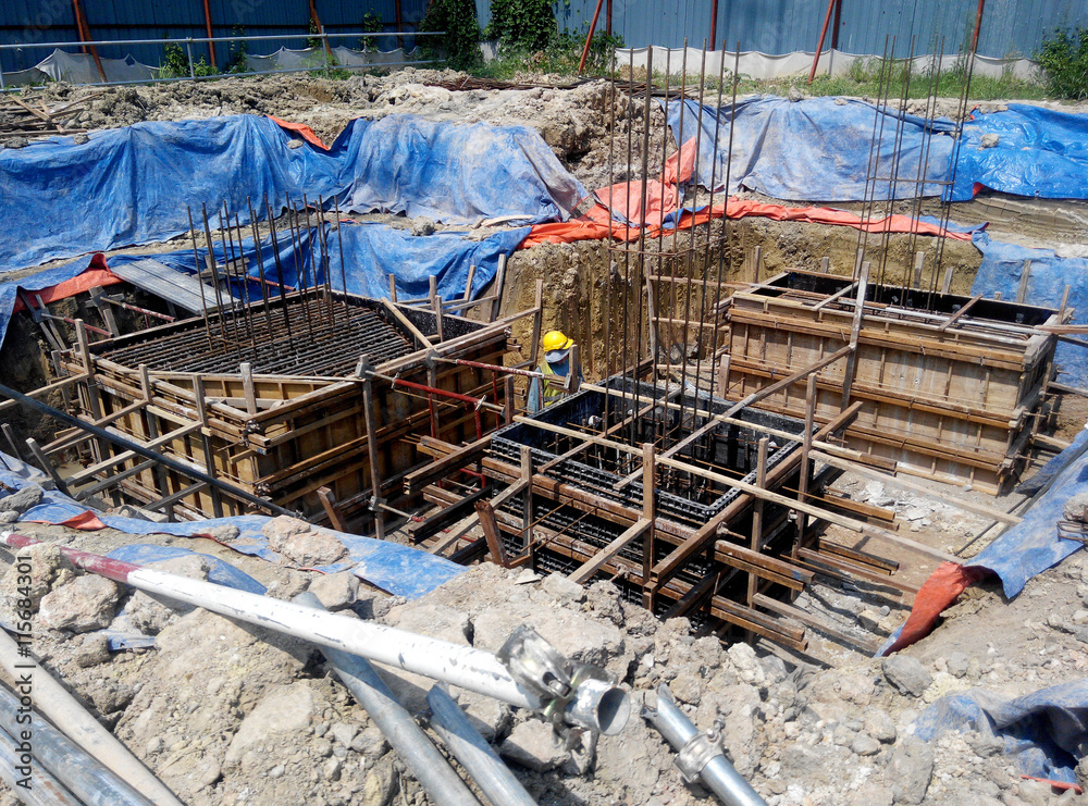 Pile cap form work with reinforcement bar in it and the excavated pile ...