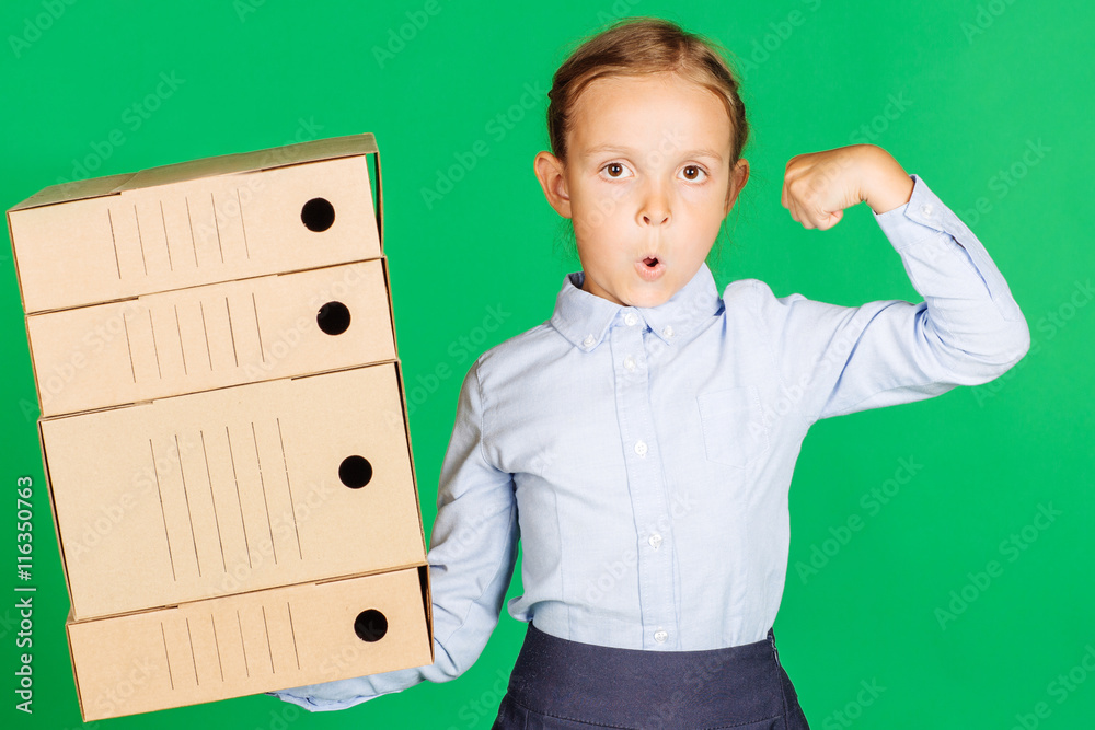 girl in a school uniform with folder or box and showing her biceps ...