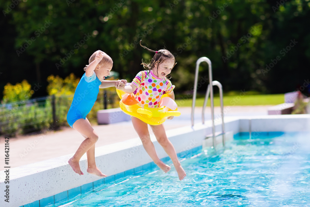 Kids jumping into swimming pool Stock Photo | Adobe Stock