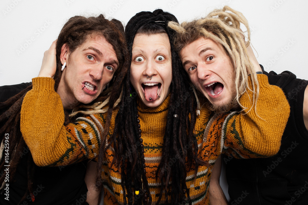 Collective portrait of three freaky people with dreadlocks and ...