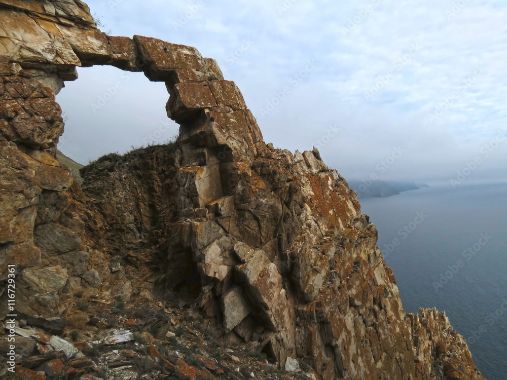 Arch rock near Aya bay at Lake Baikal. National park Pribaikalskiy ...