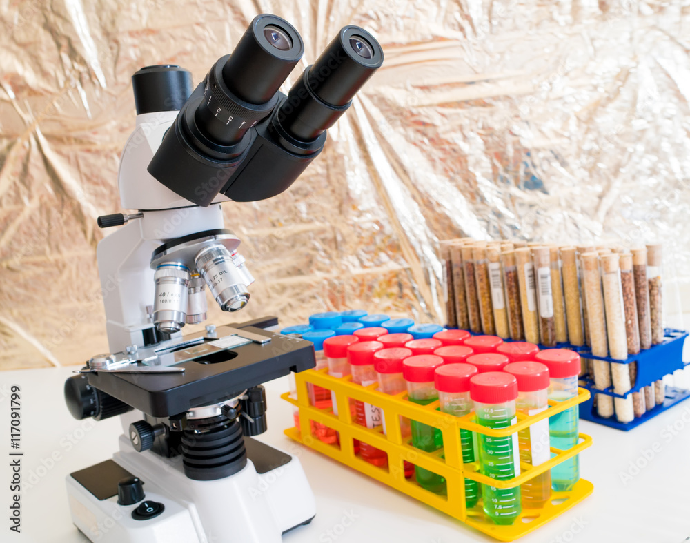 Science microscope on lab bench. Microbiology laboratory. Water ...